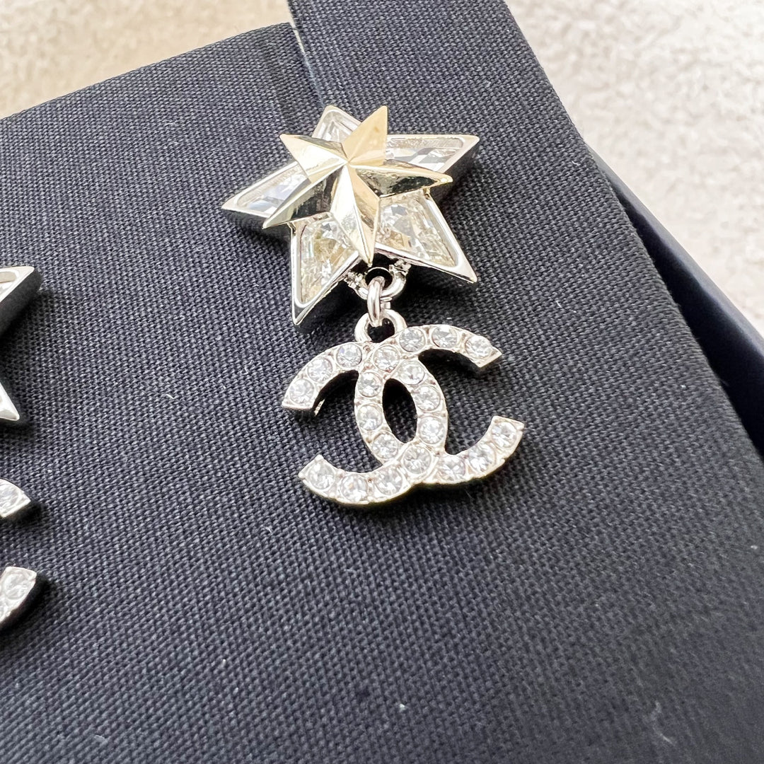 Chanel earrings with star store